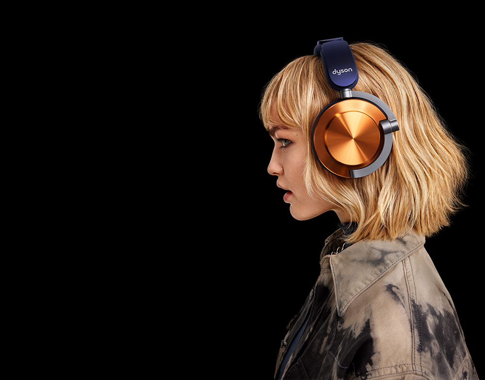 A model wearing Dyson OnTrac headphones.